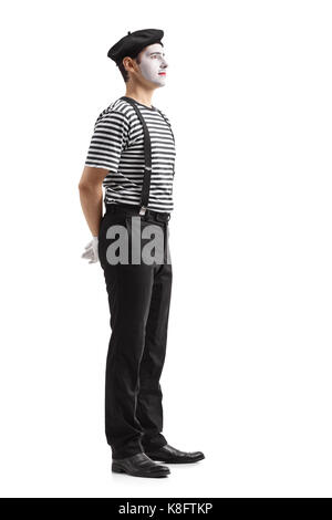 Full length profile shot of a mime with a rose waiting in line isolated ...