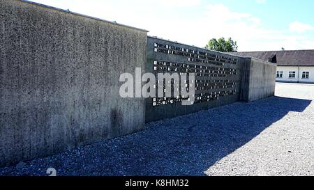 A memorial wall "Never again" written in several languages in Dachau ...