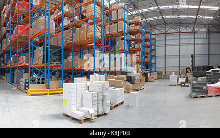 Distribution centre with high rack shelving system Stock Photo - Alamy