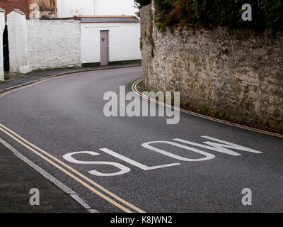 slow road marking traffic calming measure speed Stock Photo - Alamy