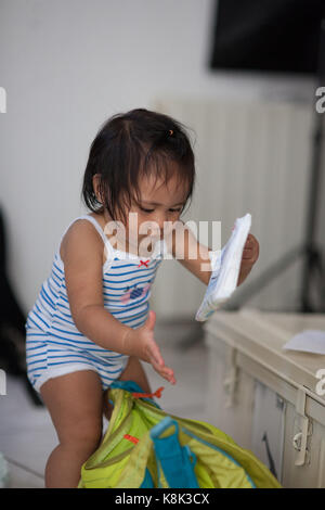 Girl with inquiring look Stock Photo - Alamy