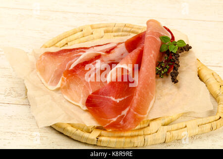 Spanish hamon ready for eat ovet the wooden background Stock Photo - Alamy