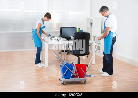 Two Cleaners With Cleaning Equipments Stock Photo - Alamy