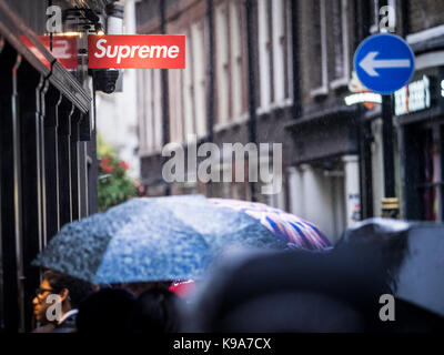 Supreme London - Customers queue outside the Supreme fashion store in ...