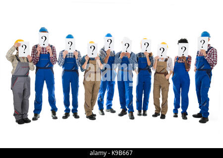 Construction Workers Hiding Faces With Question Mark Signs Stock Photo ...