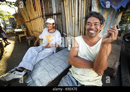 Smoking Man in Puerto Princesa, Palawan, Philippines Stock Photo - Alamy