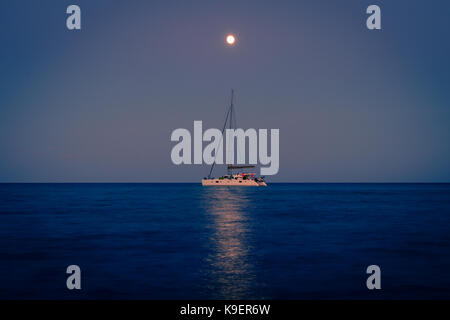 Full moon over the pinarello bay with cool reflection on the sea Stock ...
