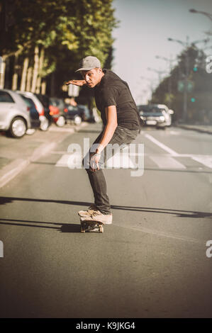 Skateboarder ride on skateboard at city street. Scater practice skate ...