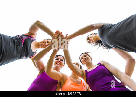 A Happy running team having fun Stock Photo - Alamy