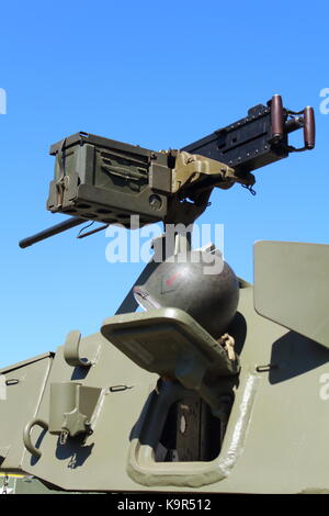 Machine gun on the turret of an armored personnel carrier. Heavy ...