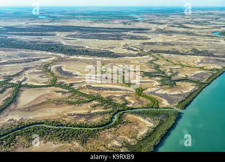 Aerial view of Albert River estuary and surrounding salt flats during ...