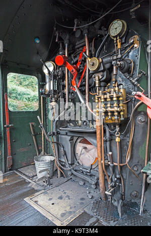 Footplate and cabin of a steam locomotive engine, showing dials, levers ...
