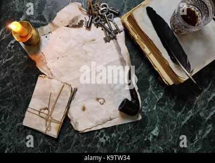 retro papers and book on detective work table with tools Stock Photo ...