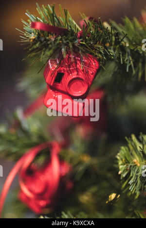Figures of decorated Christmas tree with light bulbs with dark night ...