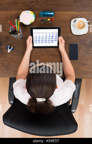High angle view of tablet computer with ingredients on kitchen counter ...