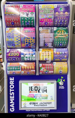 Scratchcards on display in a newsagent store Stock Photo - Alamy