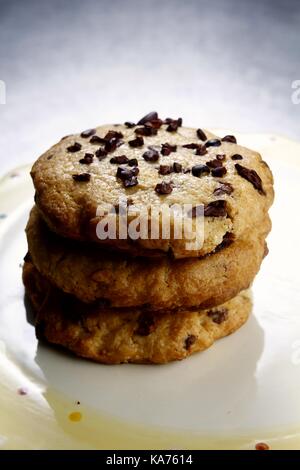 photo round chocolate chip cookies on a plate Stock Photo - Alamy
