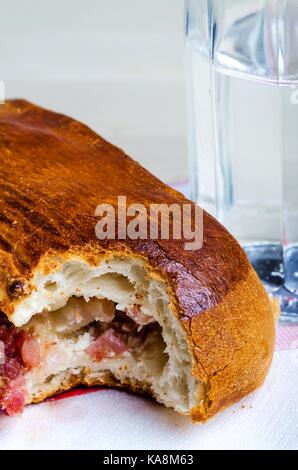 Bitten neapolitan sandwich with bacon pieces cheese Stock Photo - Alamy