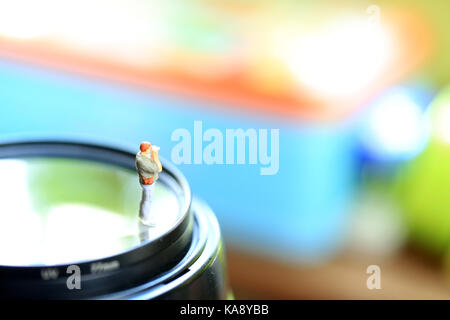 tiny man take photo Stock Photo - Alamy
