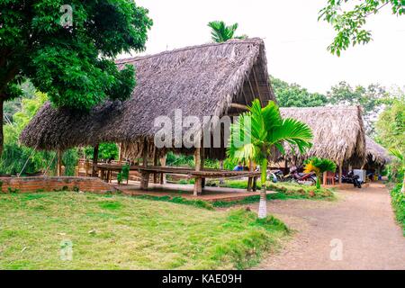 paleolithic thatched huts Stock Photo - Alamy