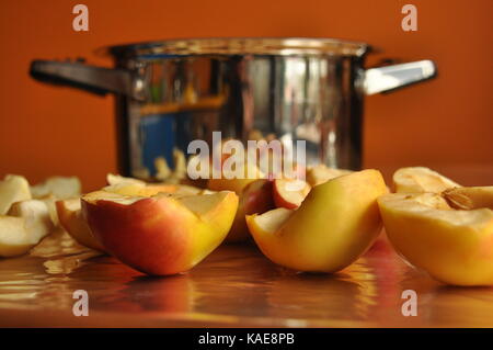 Sliced apples compote. Pot for preparing a beverage Stock Photo - Alamy