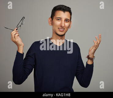 Tired businessman take-off glasses and rubbing eyes, standing exhausted ...