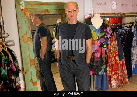 Roger Saul (holding his first Mulberry creation, a briefcase), founder ...
