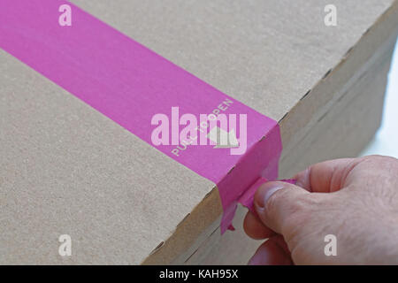 Pull to open strip at box Stock Photo - Alamy