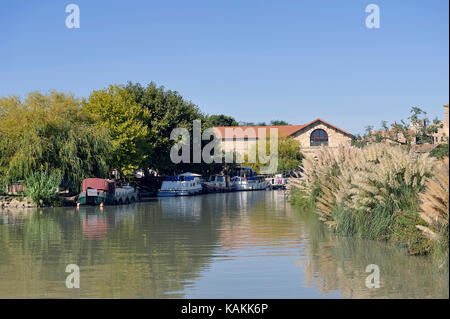 the village of Colombiers on the Canal du Midi is a tourist stop for ...