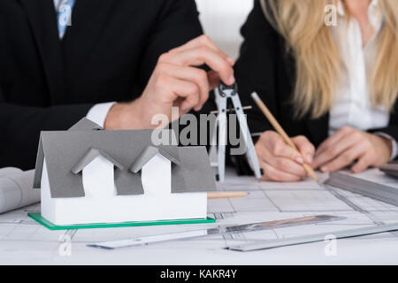architect engineer working on house blueprint of real estate project at ...