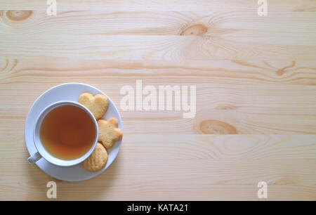 Top view of cookies with flower tea and raspberry jam, flat lay ...
