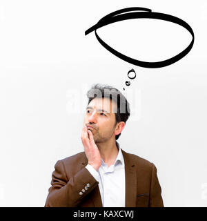 Portrait view of an attractive dubious business man with business icons ...