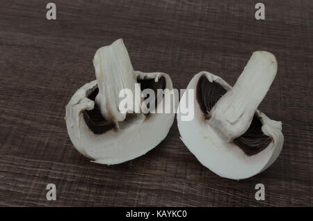 Vegetable white button mushroom cut and chopped shape one full and one ...