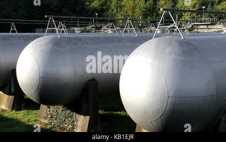 many huge tanks for the storage of methane gas in an industrial zone ...