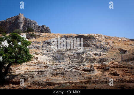 The remains of the amphitheatre in Lindos on the Greek island of Rhodes ...