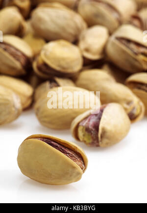 A close-up shot of roasted Pistachios ready to be eaten as a snack or ...