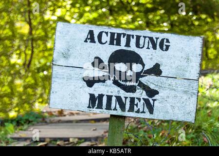 German land mines warning sign from World War Two, wet with water ...