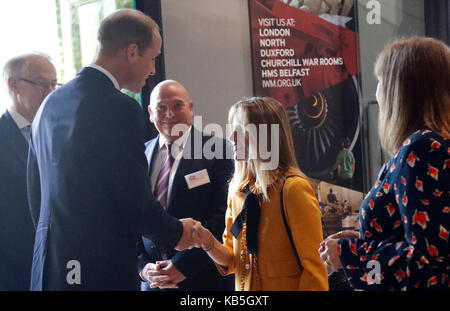 The Duke of Cambridge greets Lady Claudia Rothermere during a visit to ...