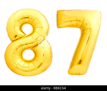 Golden number eighty seven inflatable balloon with golden ribbon flying ...