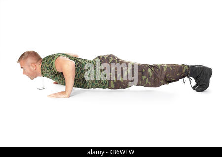 Young army soldier doing push up isolated on white background.Front ...