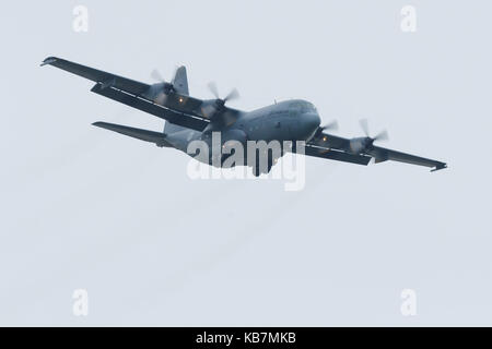 A USAF Lockheed C130 Hercules transport aircraft seen from below ...