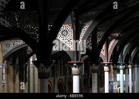 Pillars and decorative wrought iron Victorian arches supporting the ...