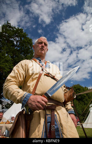 Norman soldier without body armour holding a war hammer at living ...
