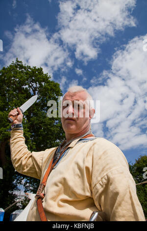 Norman soldier without body armour holding a war hammer at living ...