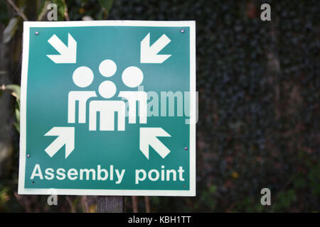 Green Emergency Assembly Point Sign Stock Photo - Alamy