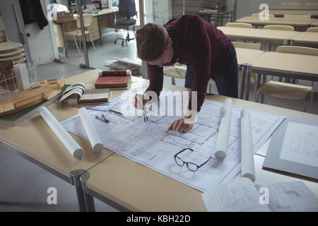 The architect working in his studio on new project Stock Photo - Alamy