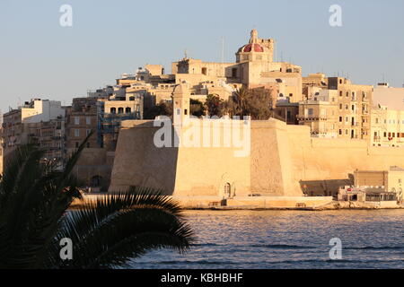 A cityscape view of La Guardiola and St Phillip's Church, evening ...