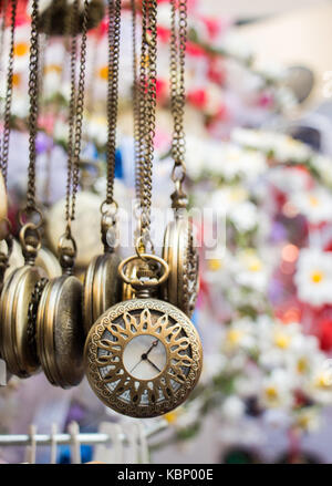 Set of retro styled pocket watches hanging Stock Photo - Alamy