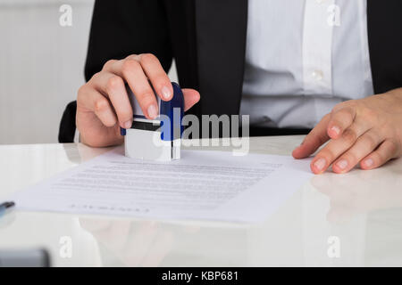 woman stamping a legal document Stock Photo - Alamy