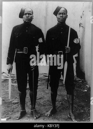 2 barefooted policemen posed full lgth., Capetown, South Africa. South ...